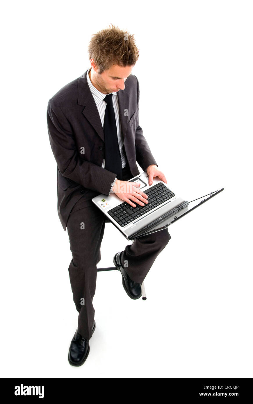 young businessman using a laptop Stock Photo - Alamy