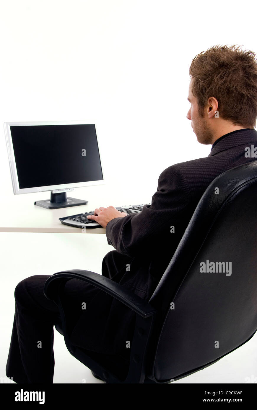man at a desk, working with the computer Stock Photo - Alamy