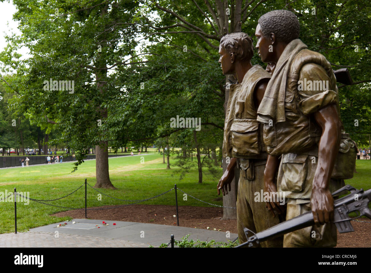 Vietnam Memorial of three soldiers looking towards the wall Stock Photo ...