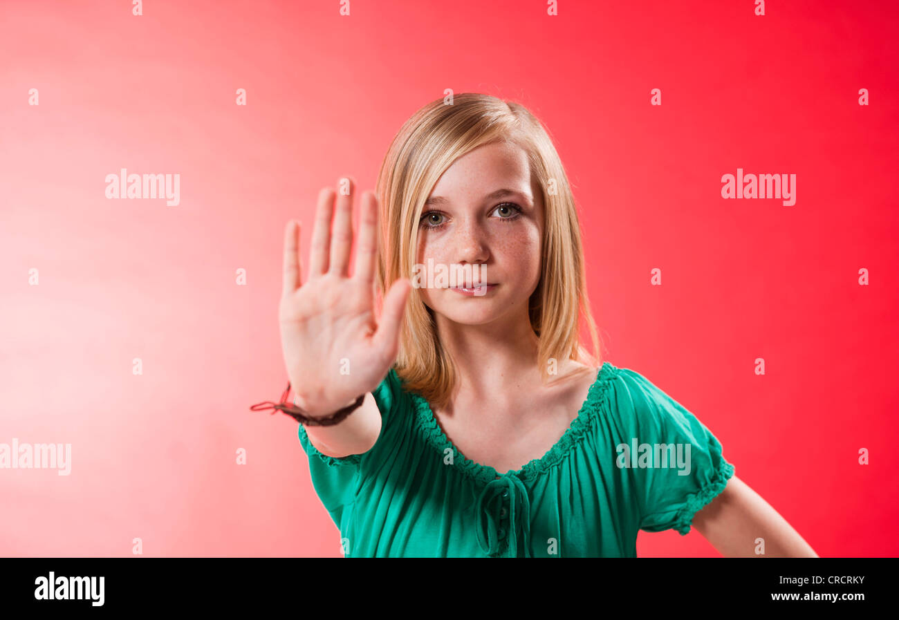 Teenage girl raising hand defense hi-res stock photography and images ...