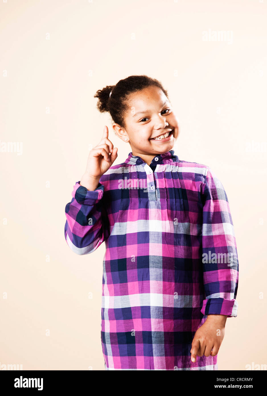 Confident girl raising her hand Stock Photo - Alamy