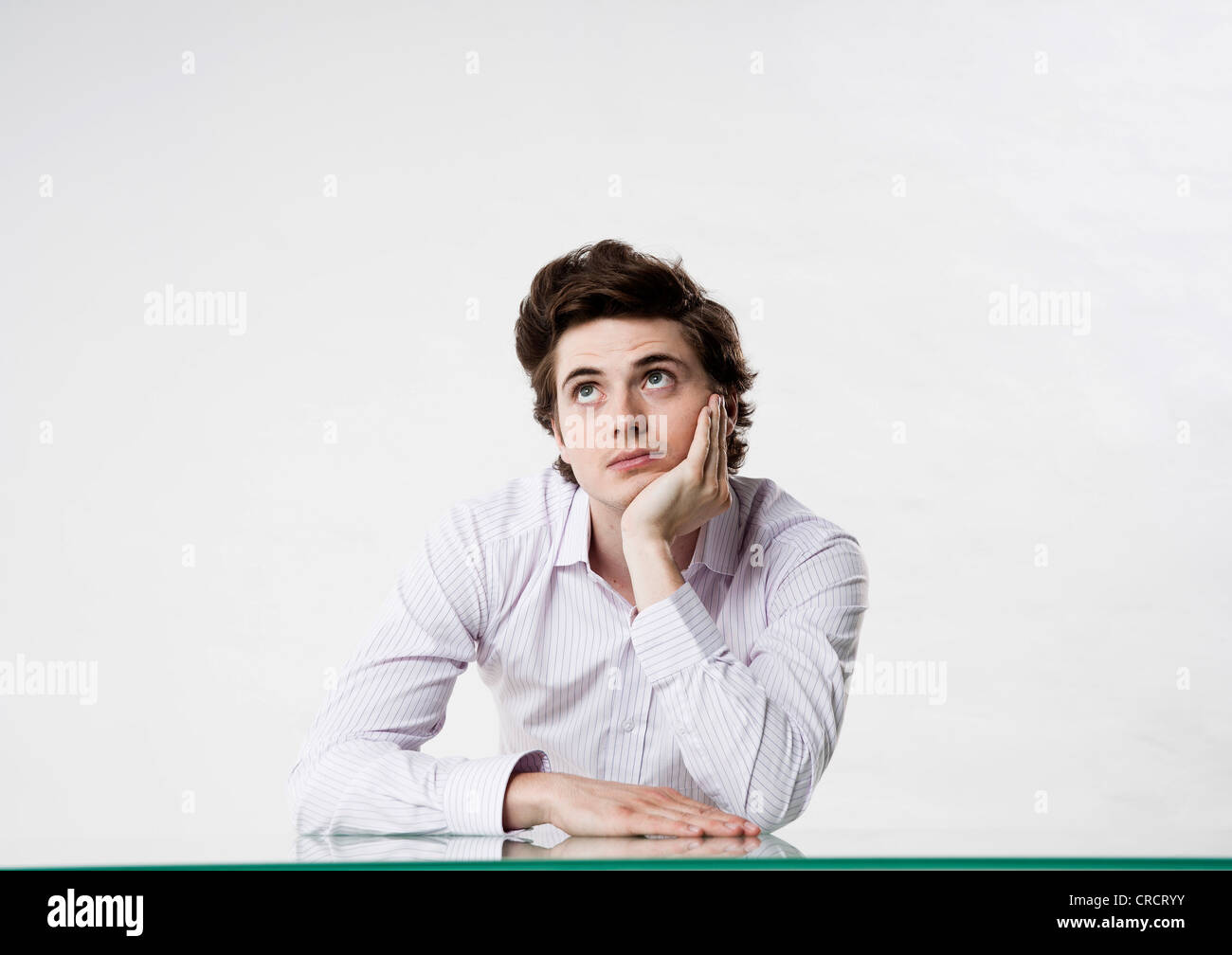 Top half length looking up thinking hi-res stock photography and images ...