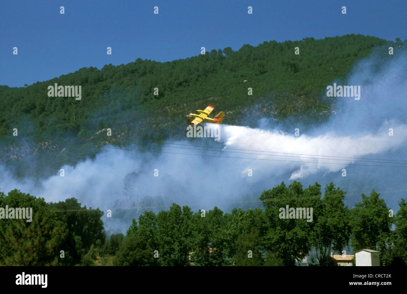 fire-fighting plane over a forest fire, France, Corsica Stock Photo - Alamy
