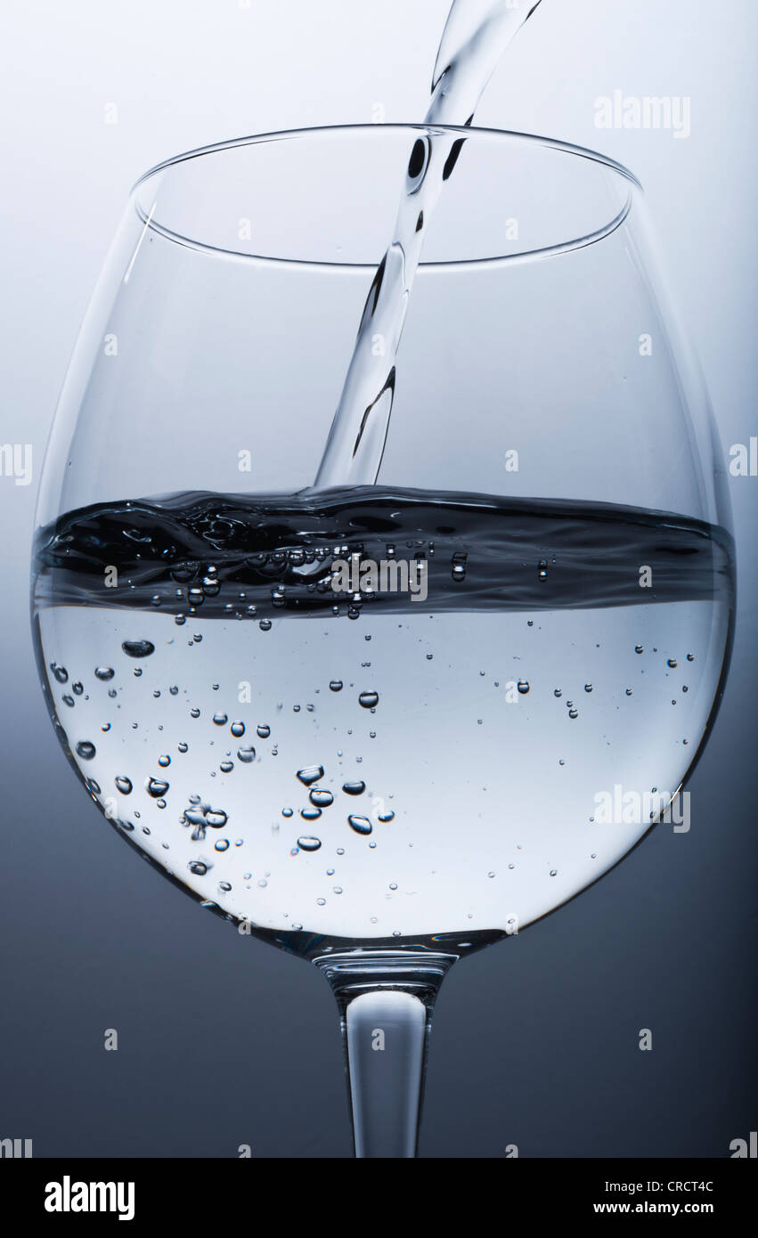 Cristal glass with mineral water Stock Photo - Alamy