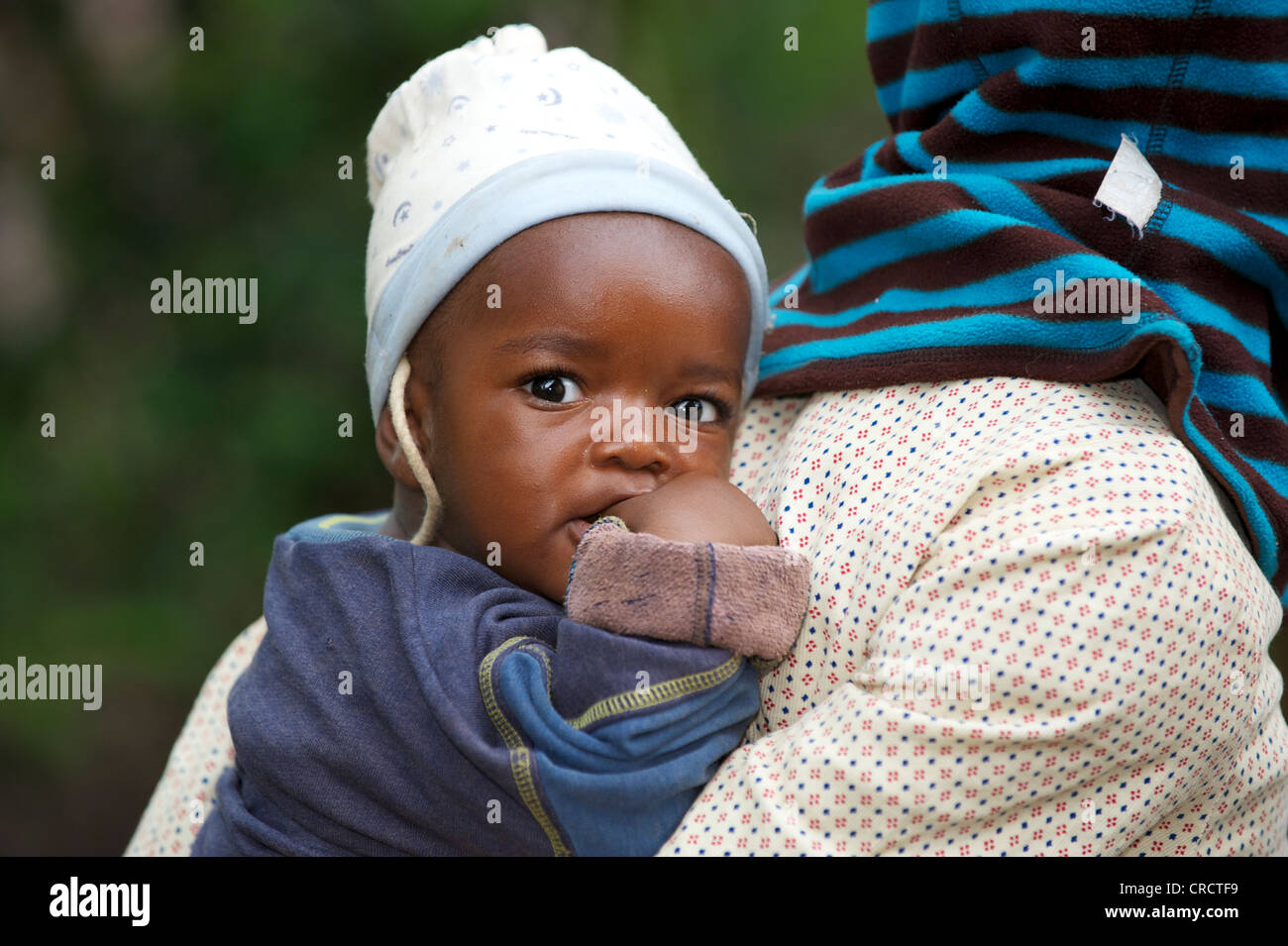 Child carried hi-res stock photography and images - Alamy