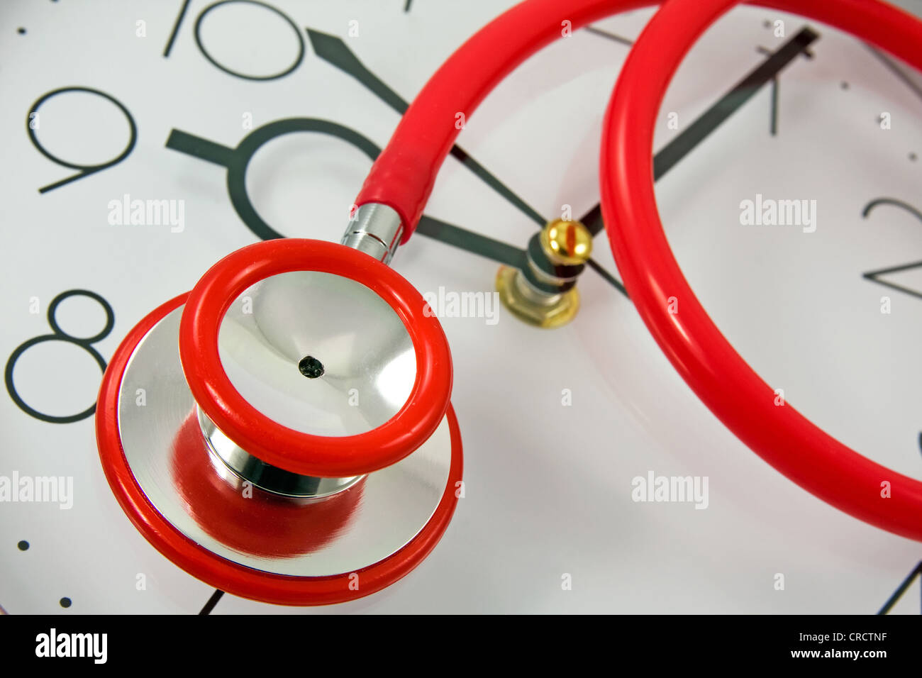 close-up of red stethoscope on silver clock Stock Photo - Alamy