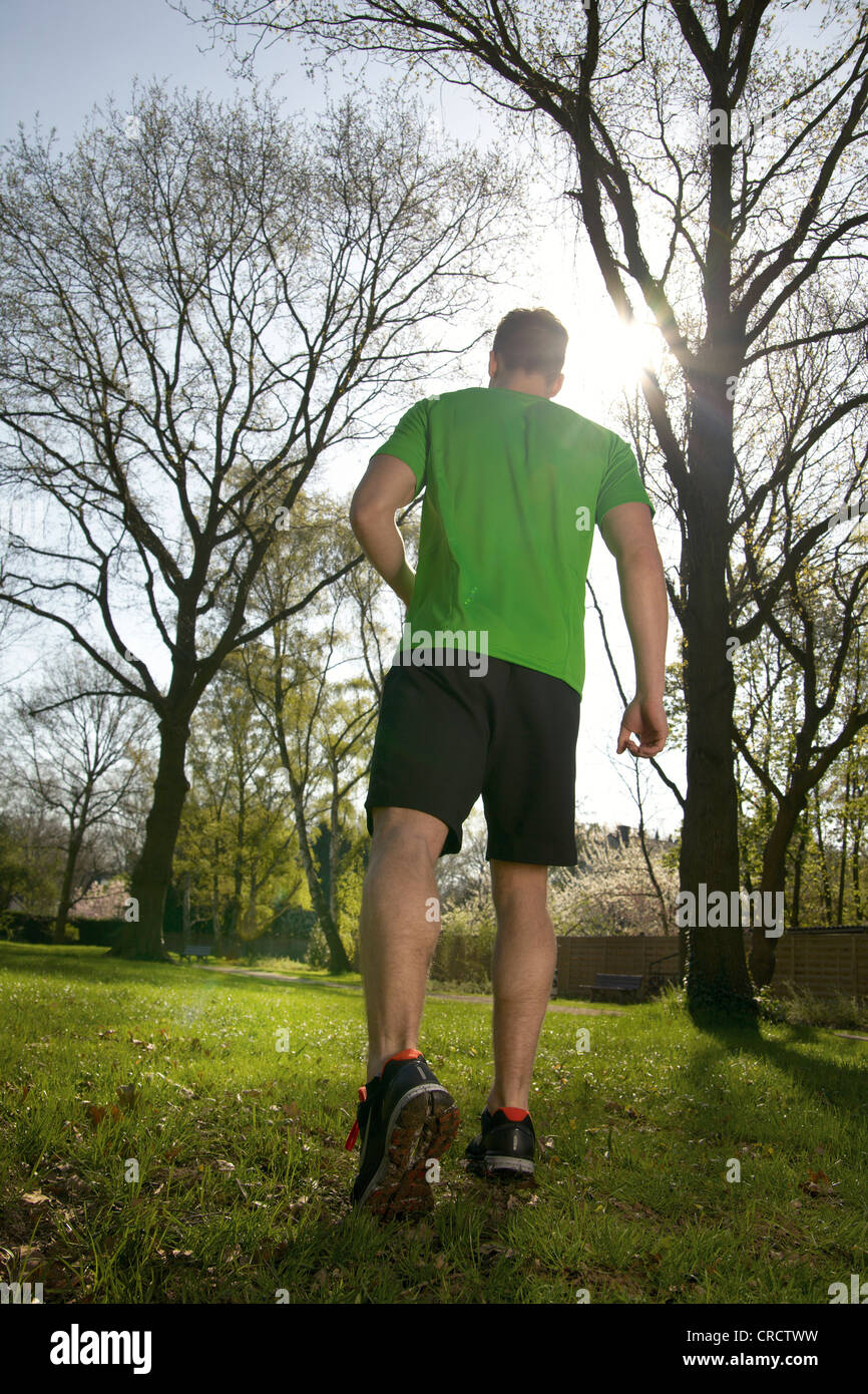 Man running over meadow Stock Photo - Alamy