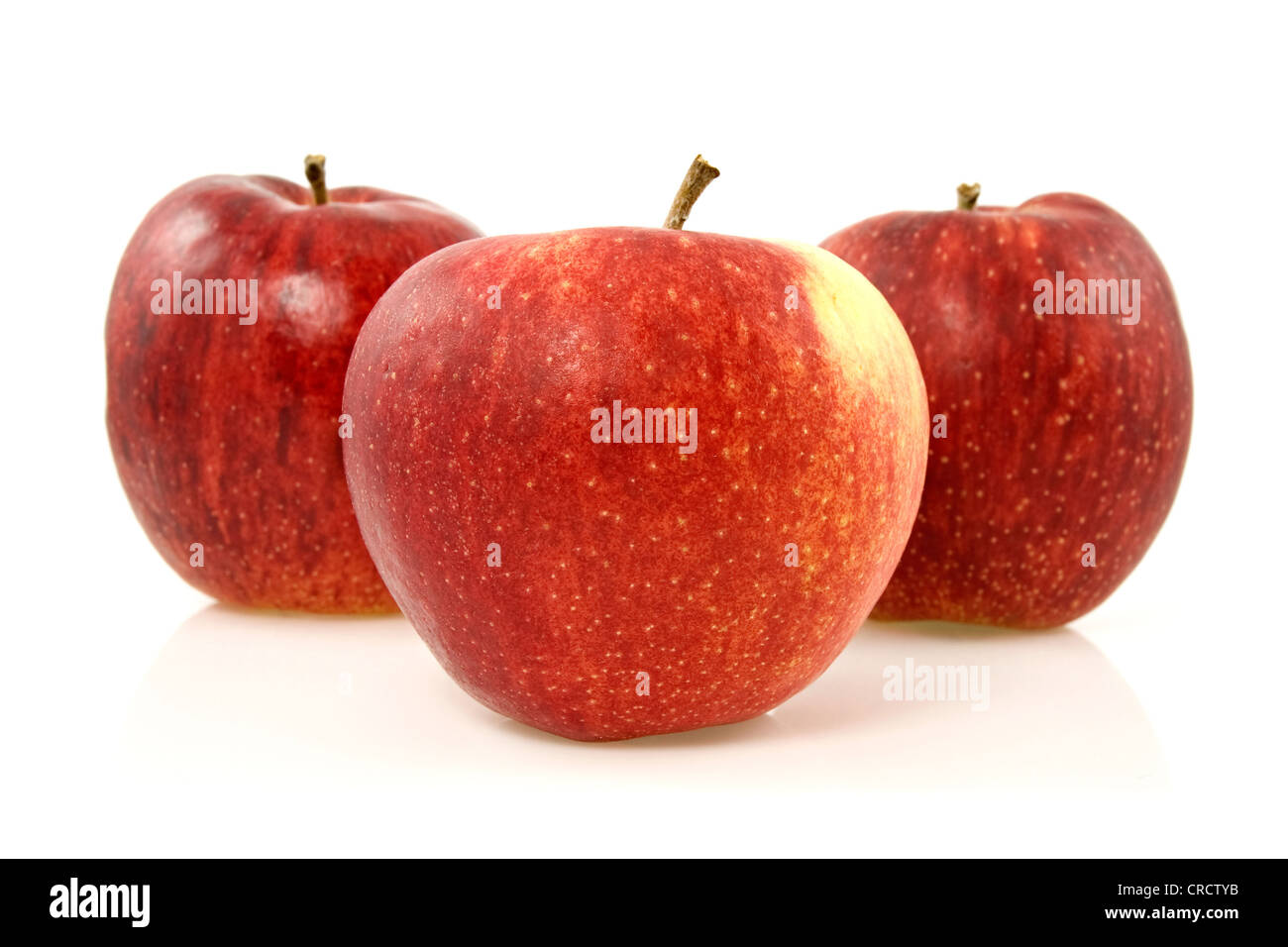 three red apples over a white background Stock Photo - Alamy