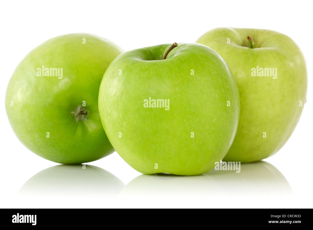 three green apples with reflection on white background Stock Photo - Alamy