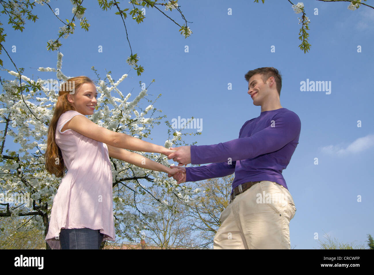 Low angle shot couple holding hi-res stock photography and images - Alamy