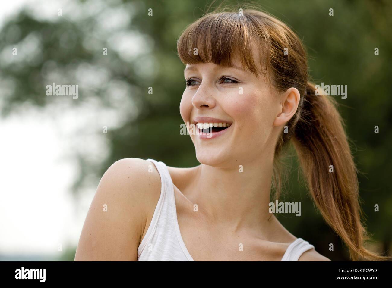 Young woman smiling, portrait Stock Photo - Alamy