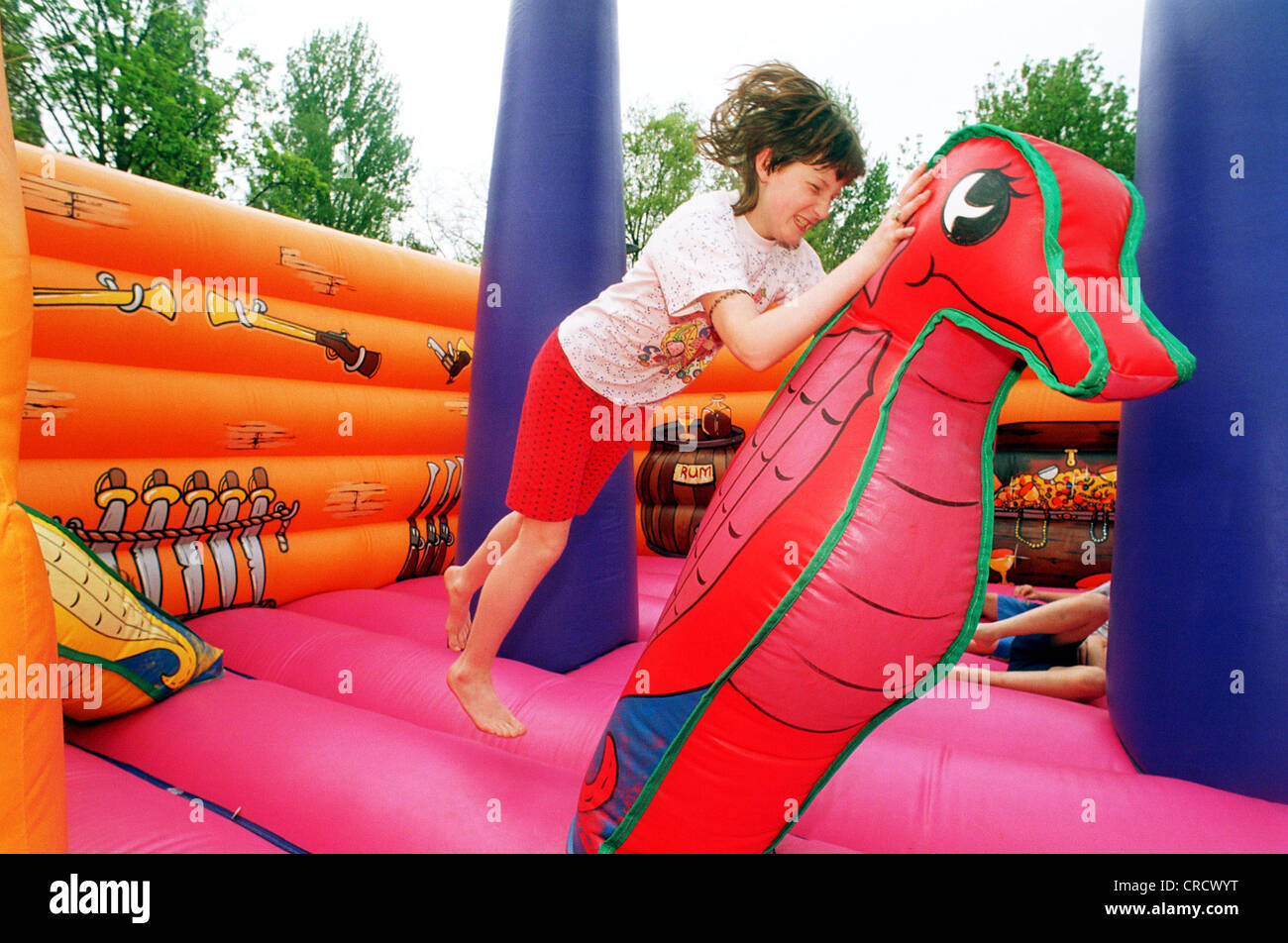 Children in bouncy castle hi-res stock photography and images - Alamy