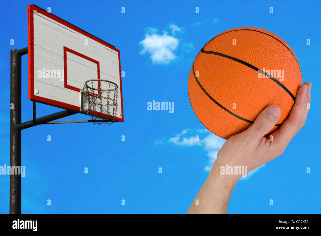 basketball hoop and human hand with ball Stock Photo - Alamy