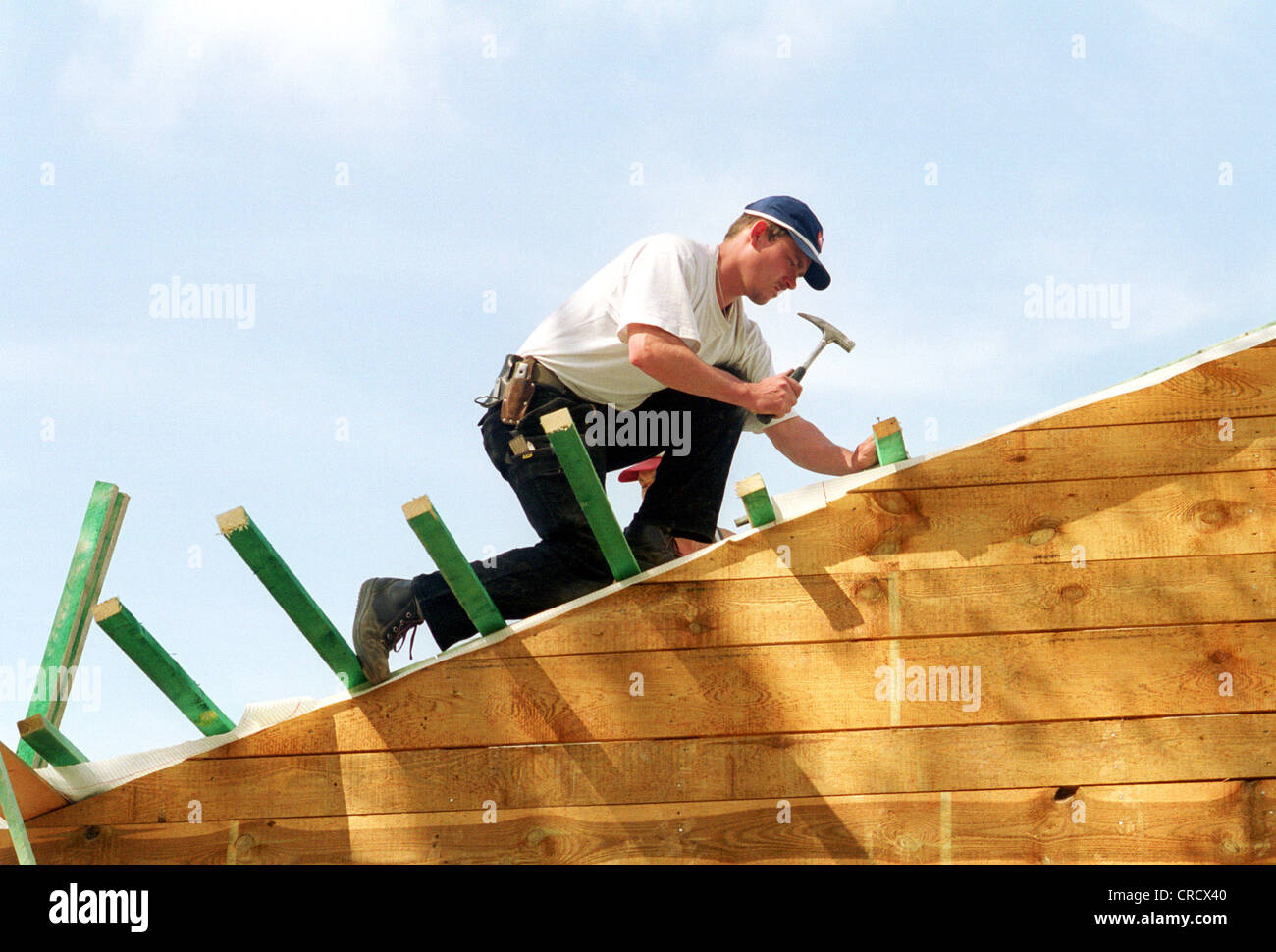 Carpenter to build a roof truss Stock Photo - Alamy