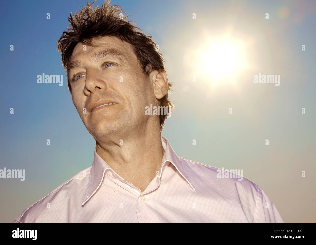 Man outdoors looking around Stock Photo - Alamy