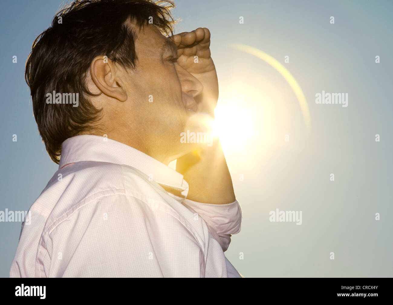 Man outdoors looking around Stock Photo - Alamy