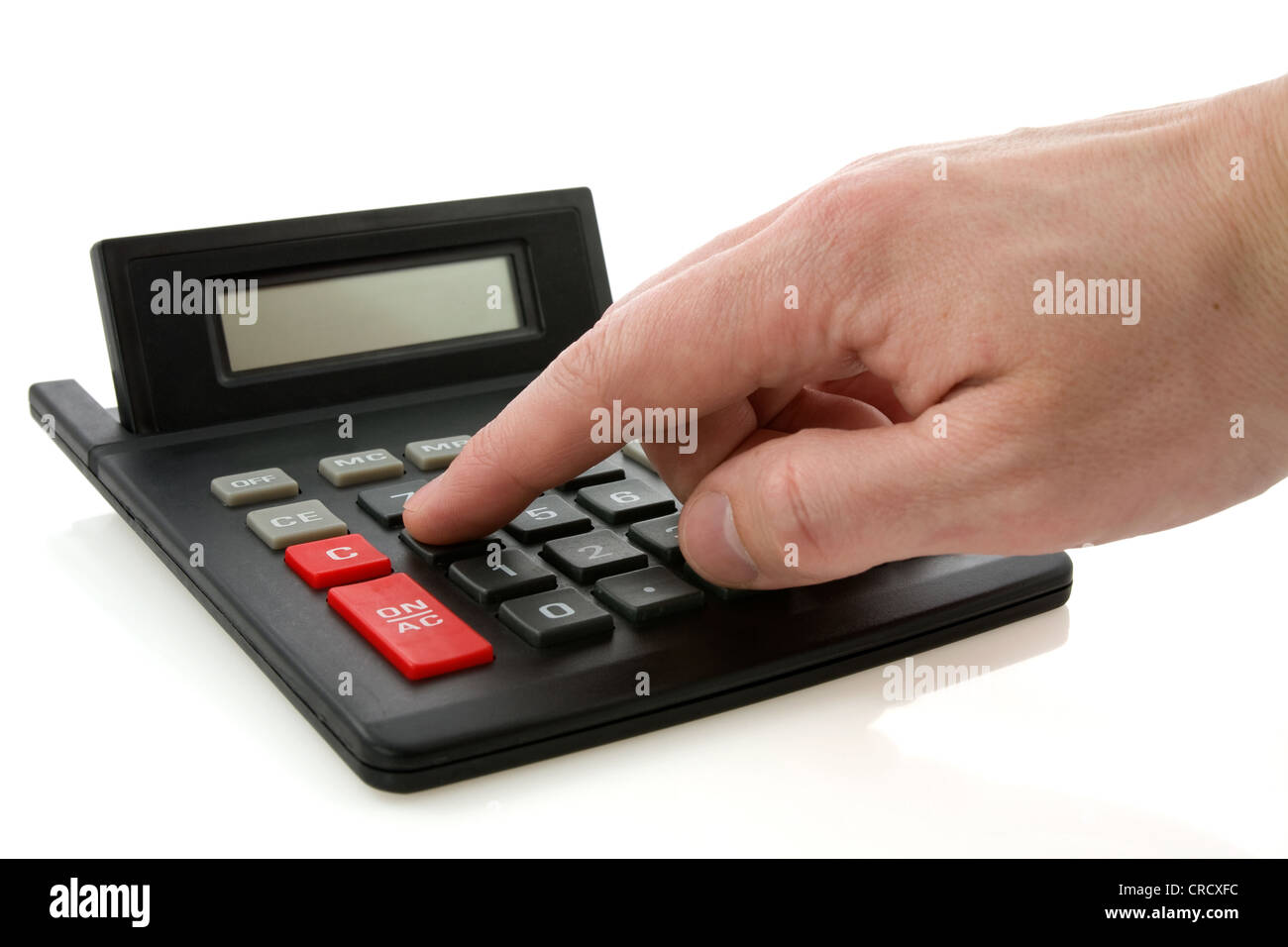 calculator and hand over a white background Stock Photo - Alamy