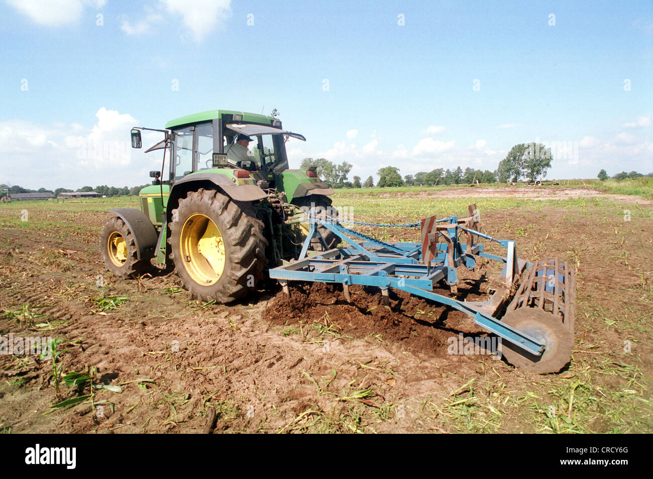 Farmer when plowing with the tractor Stock Photo - Alamy