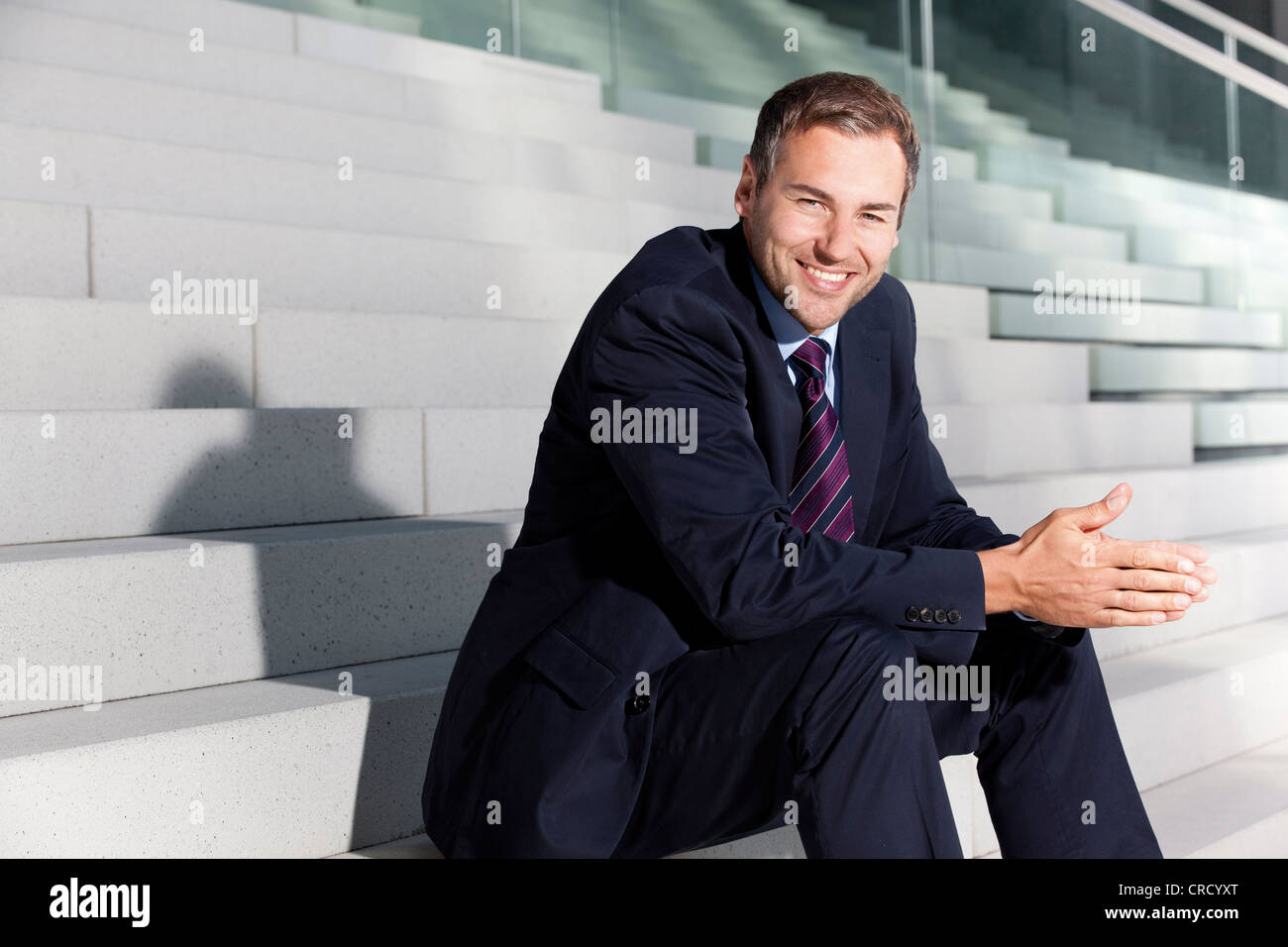 Sitting seated on steps stairs staircase hi-res stock photography and ...
