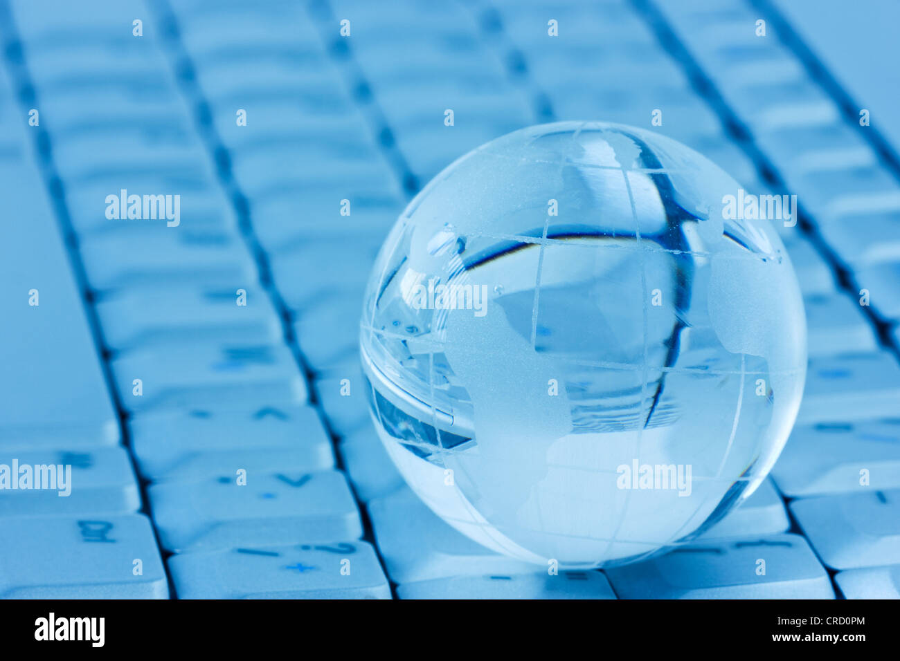 global communication concept. Crystal-glass globe on the computer ...
