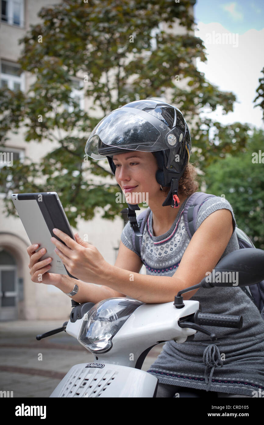 Women two wheeler scooter hi-res stock photography and images - Alamy