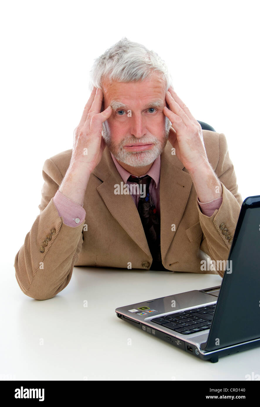 older, overstrained businessman using laptop Stock Photo - Alamy