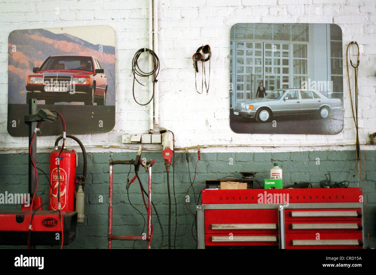 Tools and car poster on the wall in a car workshop Stock Photo - Alamy