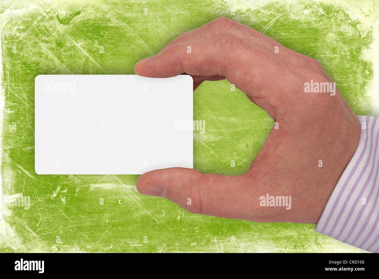 hand with blank card on green background Stock Photo - Alamy