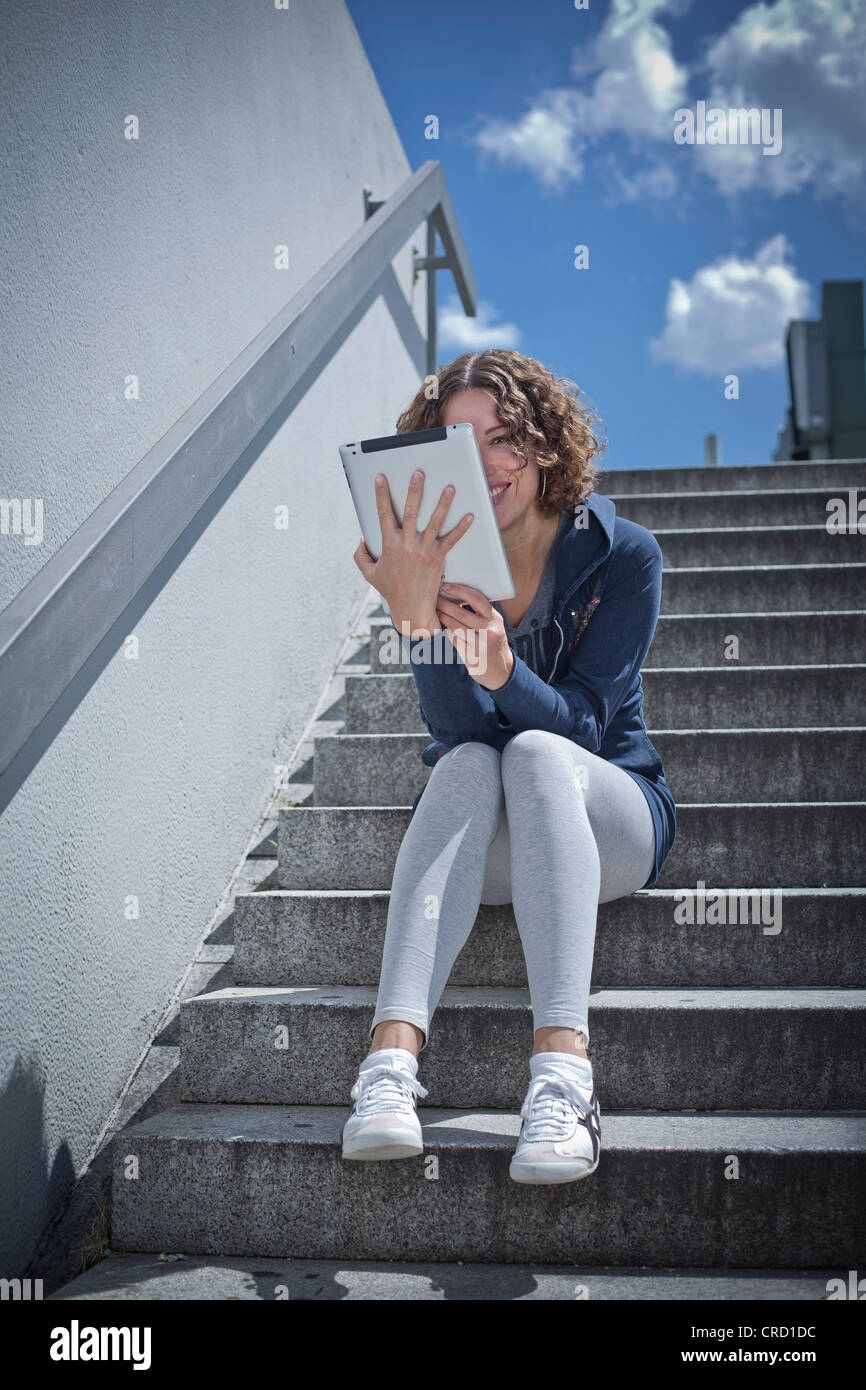 Sitting seated on steps stairs staircase hi-res stock photography and ...