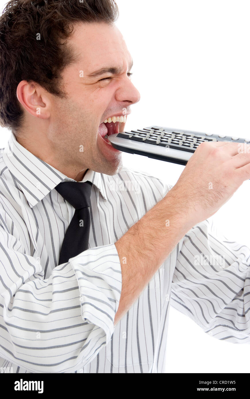 aggressive businessman biting in keyboard Stock Photo - Alamy