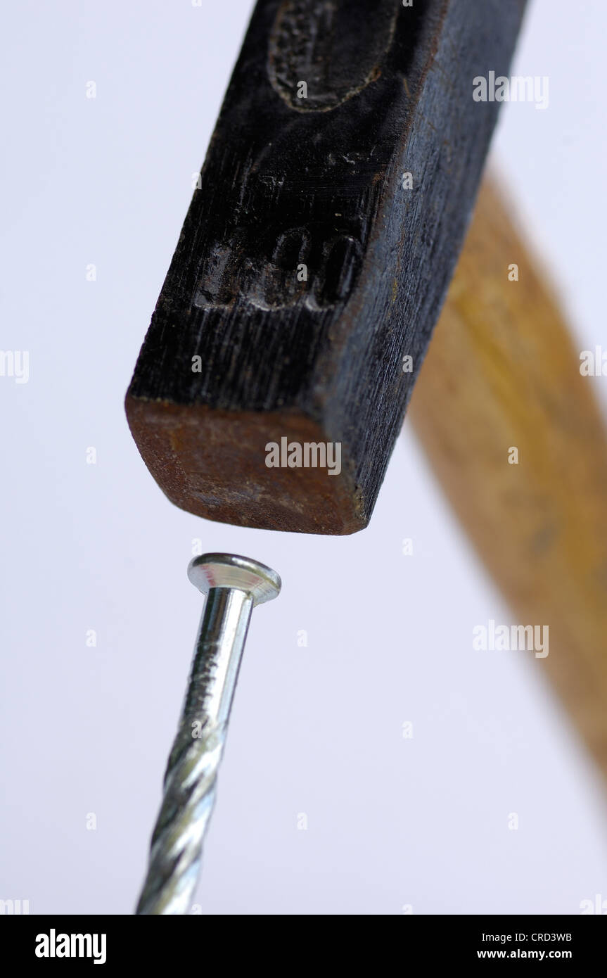 Hammer nail on white Cut Out Stock Images & Pictures - Alamy