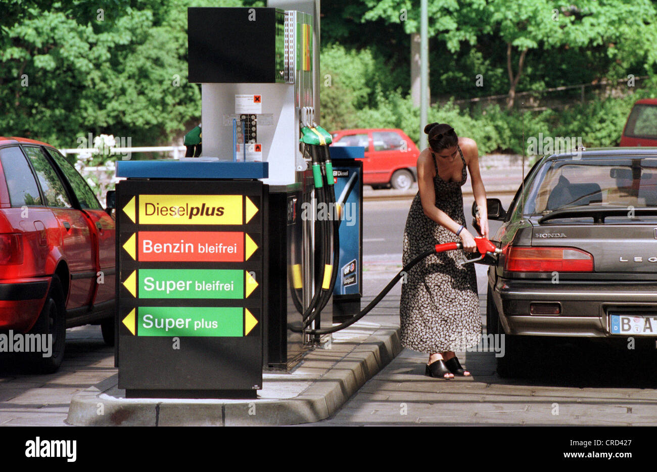 Elf Oil gas station, wife when refueling Stock Photo - Alamy