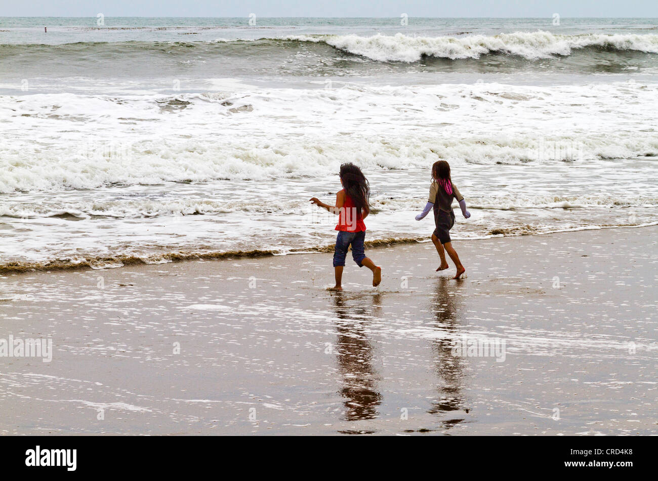 Children playing in the surf hi-res stock photography and images - Alamy