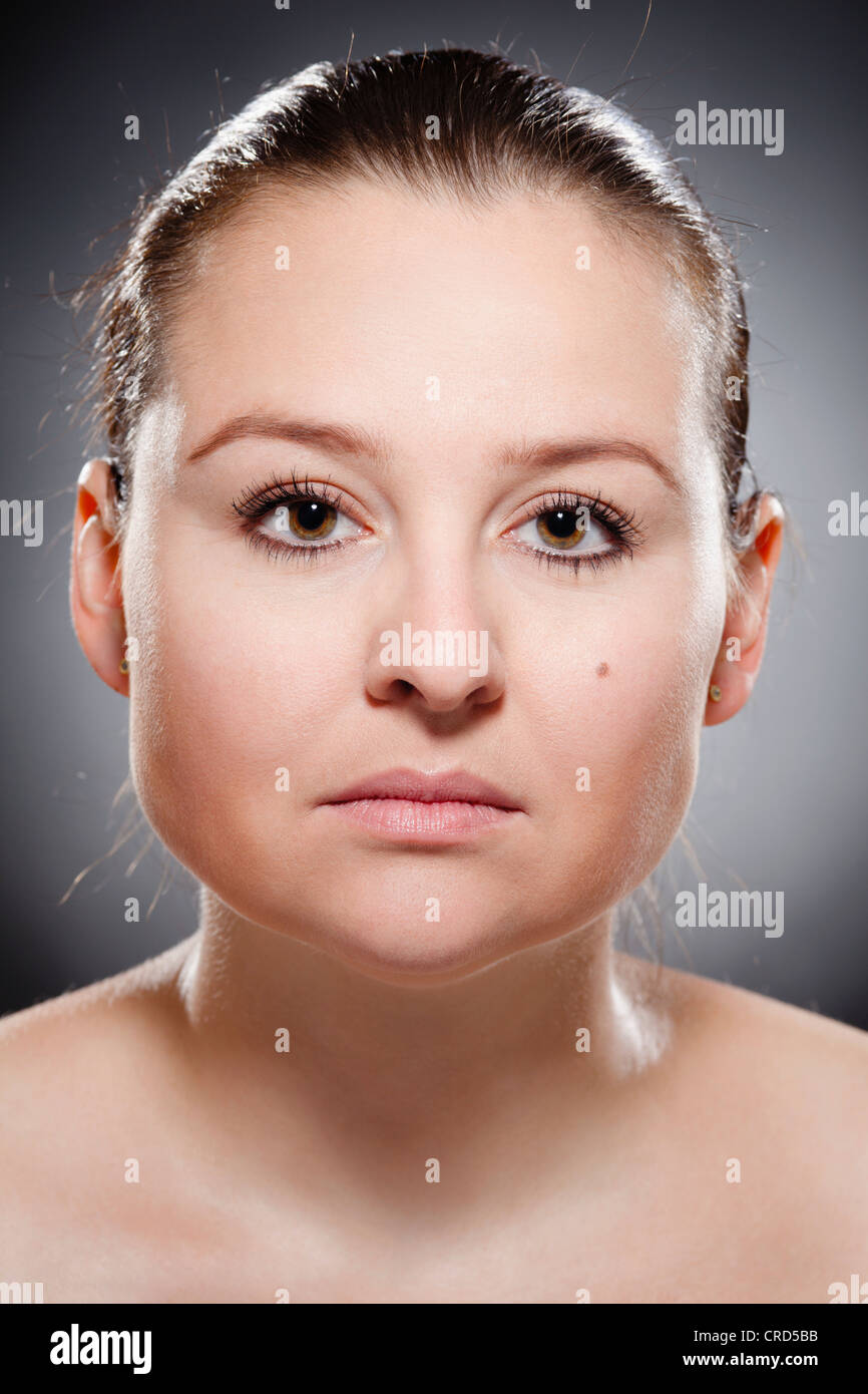 Young woman neutral non expressive hi-res stock photography and images ...