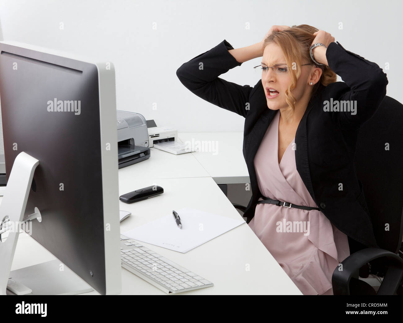 Office worker woman desk bright colours hi-res stock photography and ...