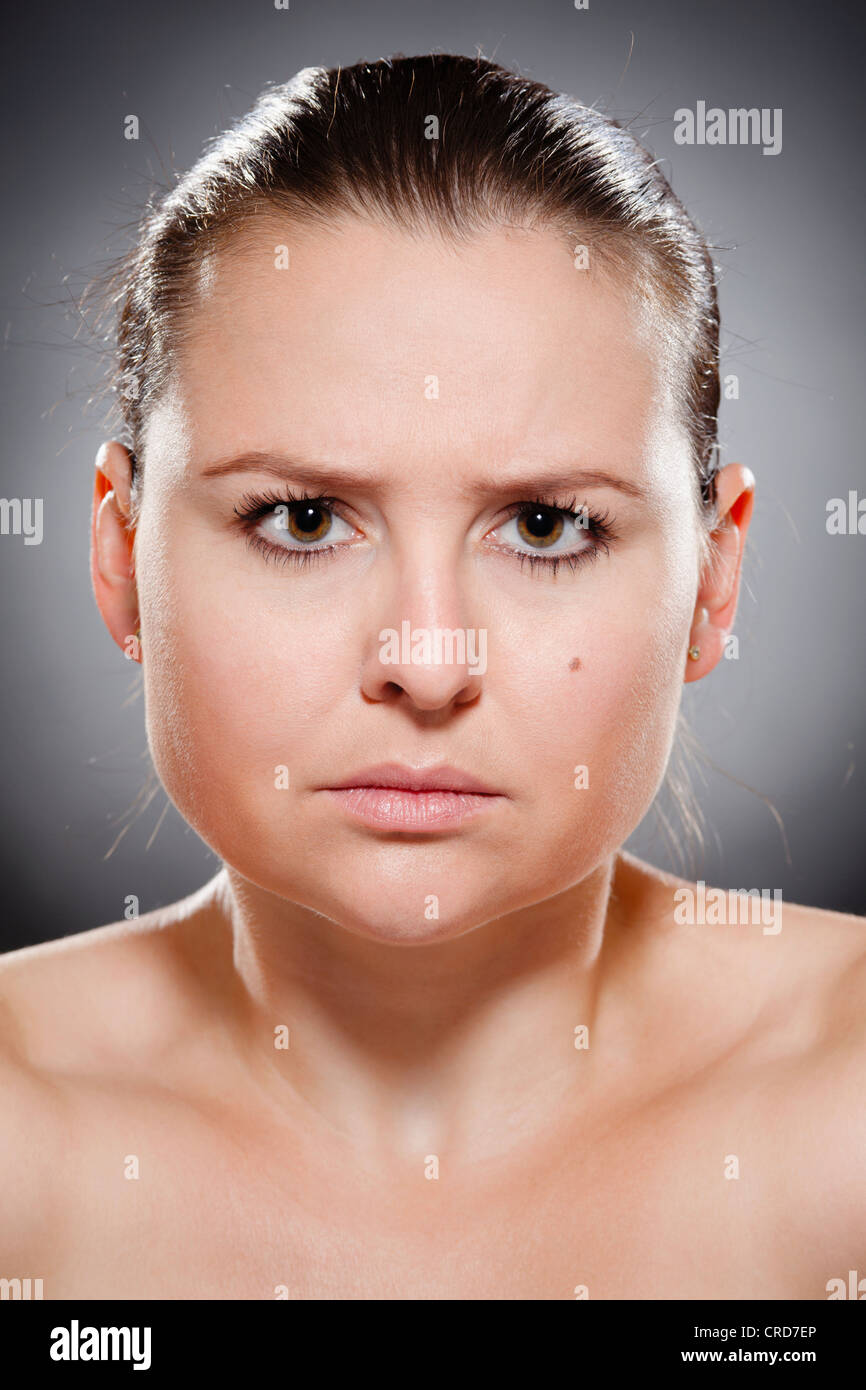 Young woman looks intently Stock Photo - Alamy