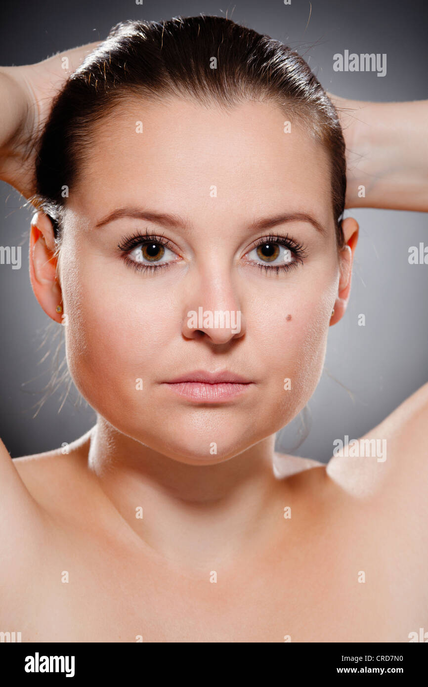 Young woman with thoughtful expression Stock Photo - Alamy