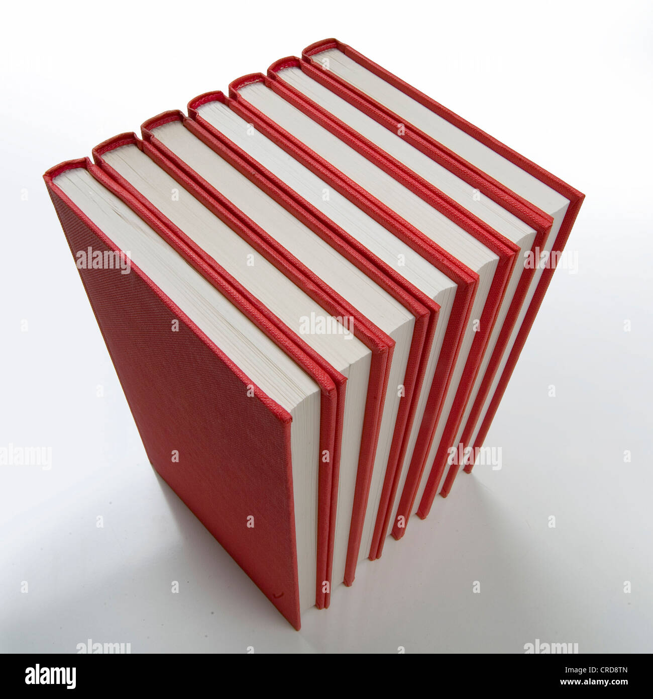 seven red books on white Stock Photo - Alamy
