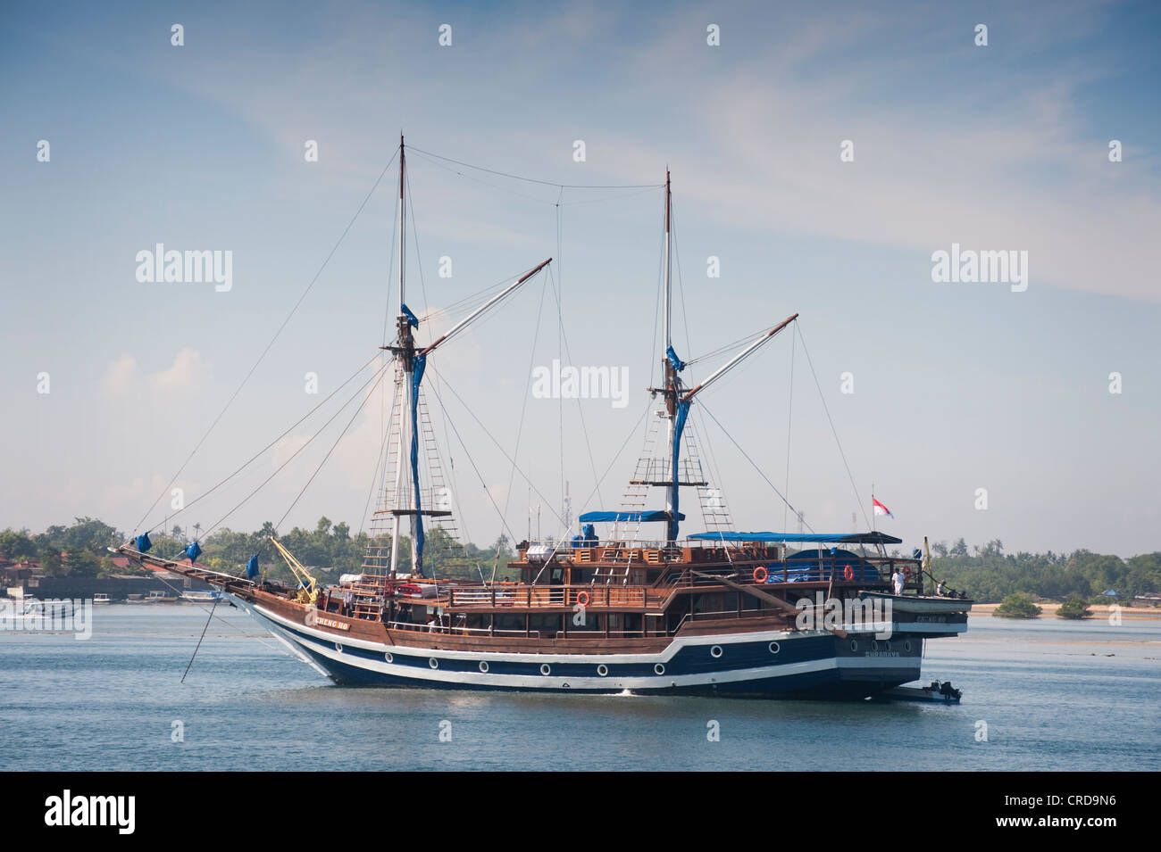 A traditional Buginese schooner at anchor in Benoa Harbor in southern ...