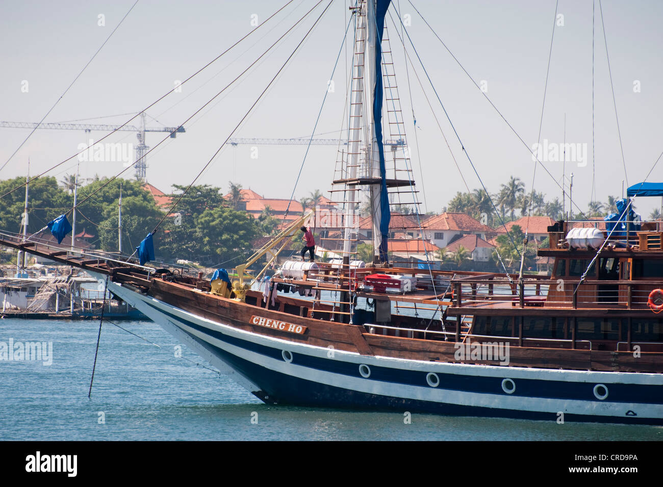 A traditional Buginese schooner at anchor in Benoa Harbor in southern ...