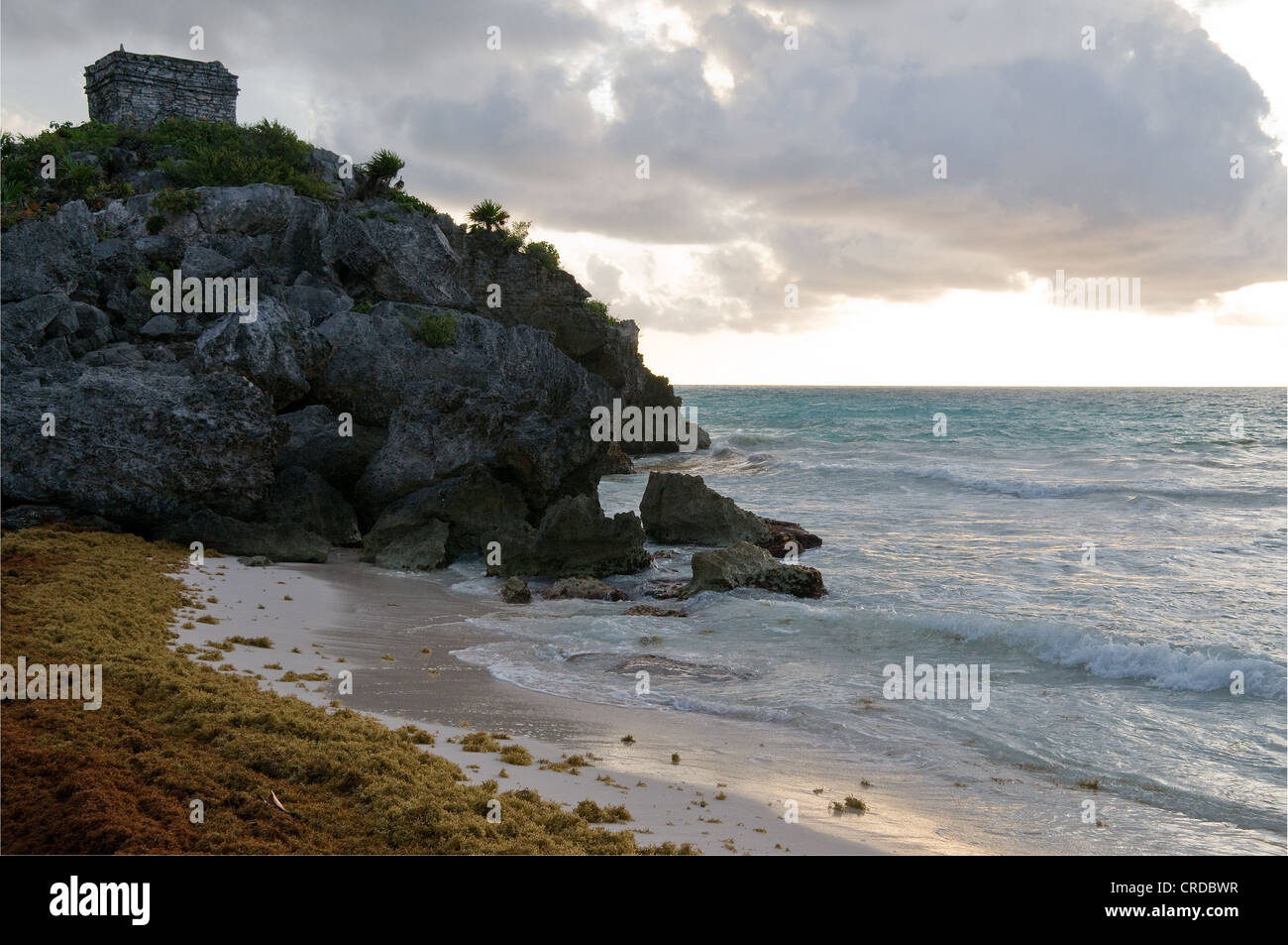Tulum's Temple of the Wind which sits on a cliff overlooking the ...