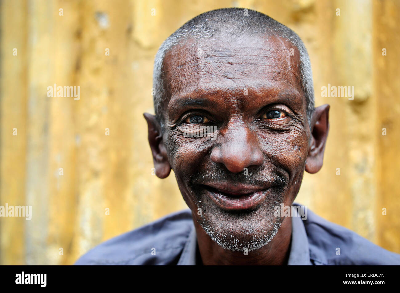 Portrait of a smiling elderly man, probably of Indian origin, in Yangon ...