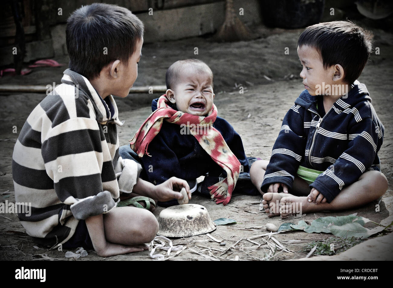 Crying baby and two boys in Laos, Southeast Asia, Asia Stock Photo - Alamy