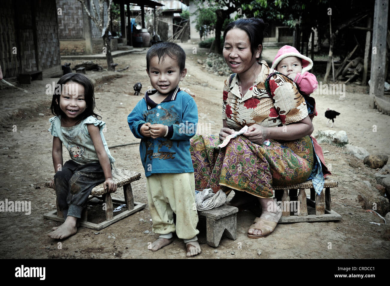 Asian mother and children in a mountain village, Laos, Southeast Asia ...