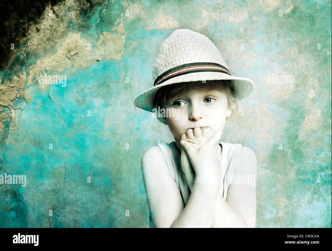 Five-year-old boy wearing a hat, sad face, portrait Stock Photo - Alamy