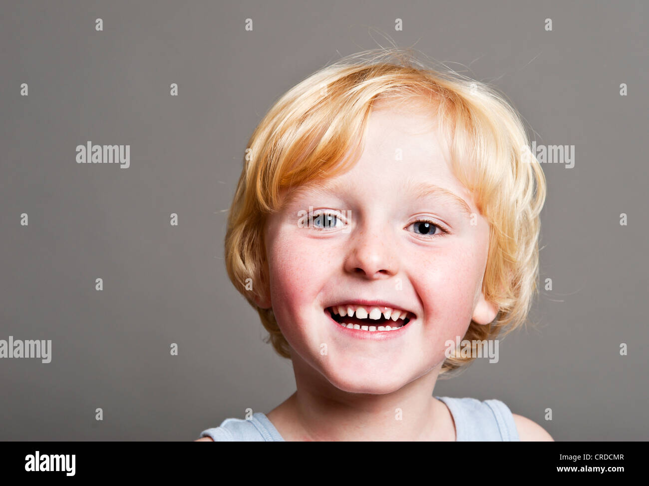 Blonde boy smiling hi-res stock photography and images - Alamy