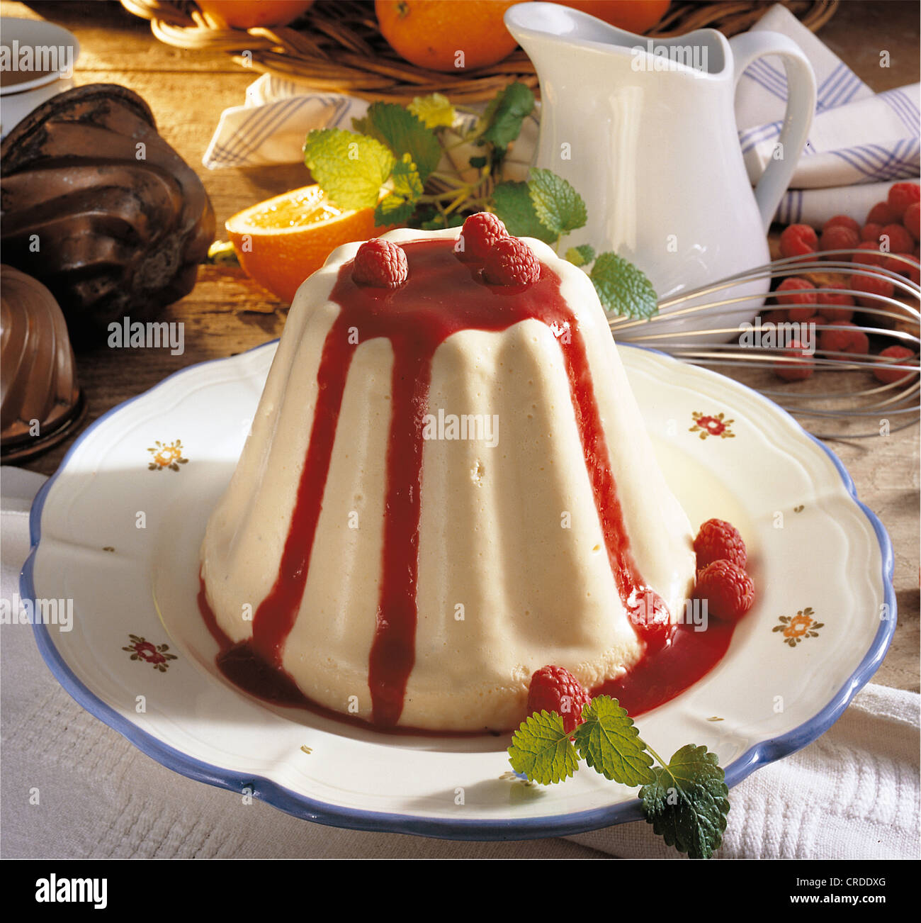 Half frozen vanilla mousse with raspberry puree, Germany Stock Photo ...