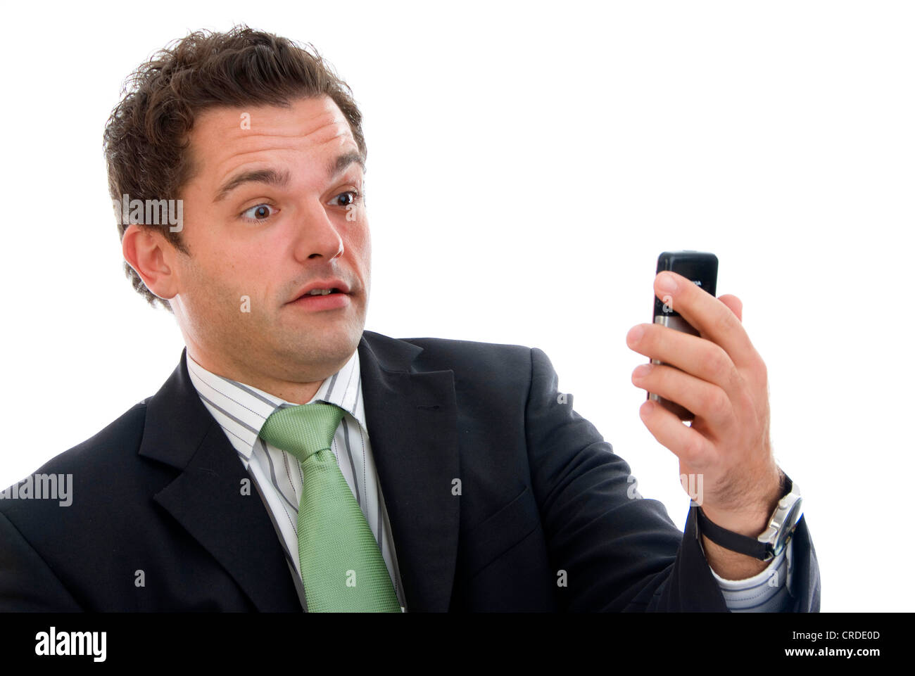 scared businessman staring at his mobile phone Stock Photo - Alamy