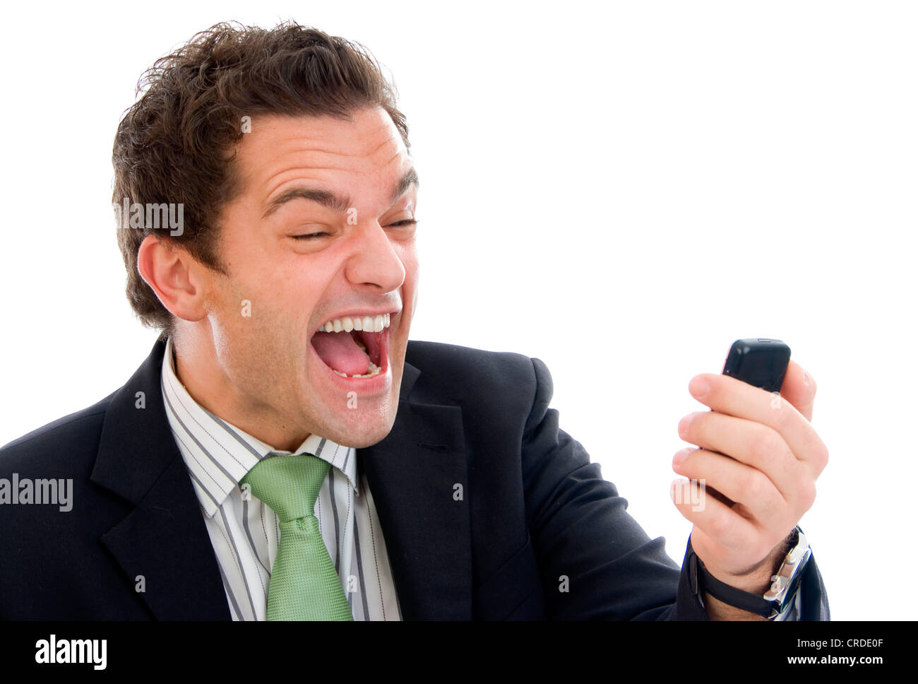 young businessman screaming at his mobile phone Stock Photo - Alamy