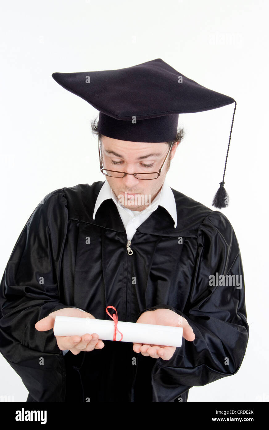 degree holder looking at his certificate Stock Photo - Alamy